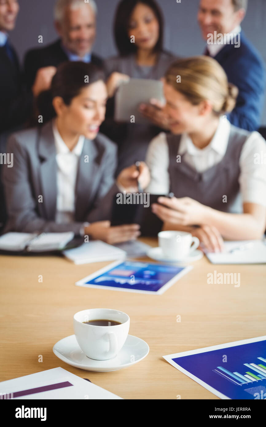 Cup of coffee on table in conference room Stock Photo - Alamy