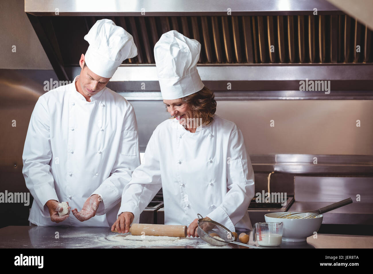 Focused chef preparing a cake Stock Photo - Alamy