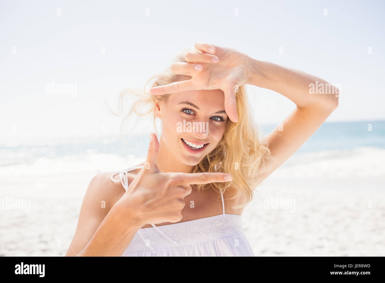 Woman making square with hands Stock Photo - Alamy
