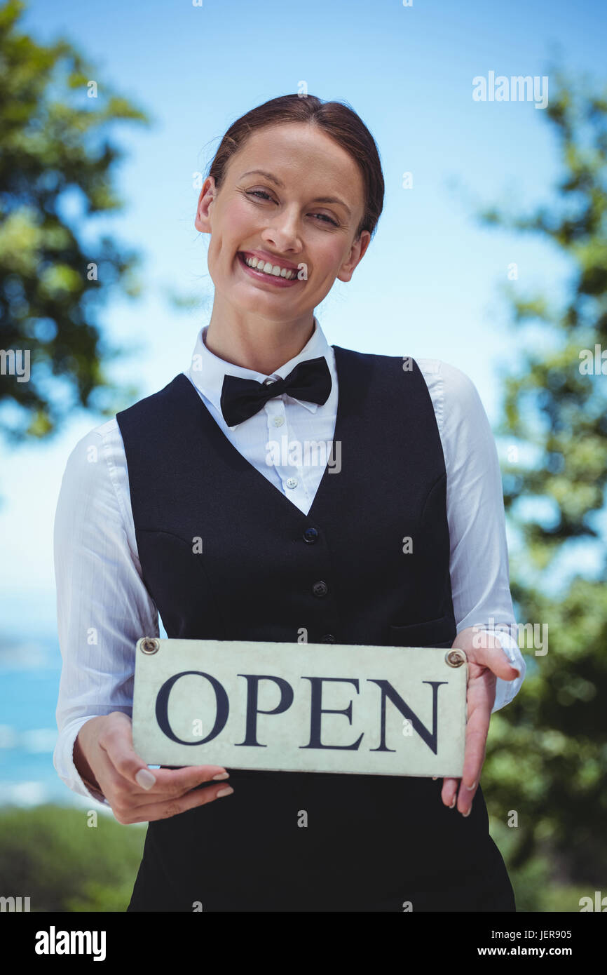 Portrait waitress showing open hi-res stock photography and images - Alamy