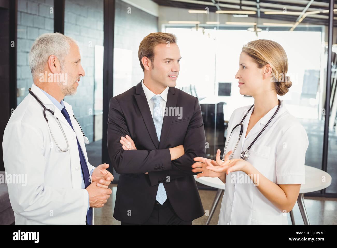 Medical team interacting with each other Stock Photo - Alamy