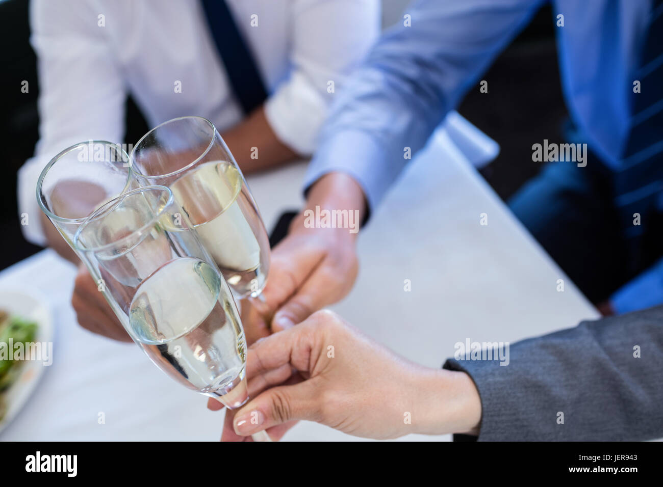 Hands toasting with champagne Stock Photo - Alamy