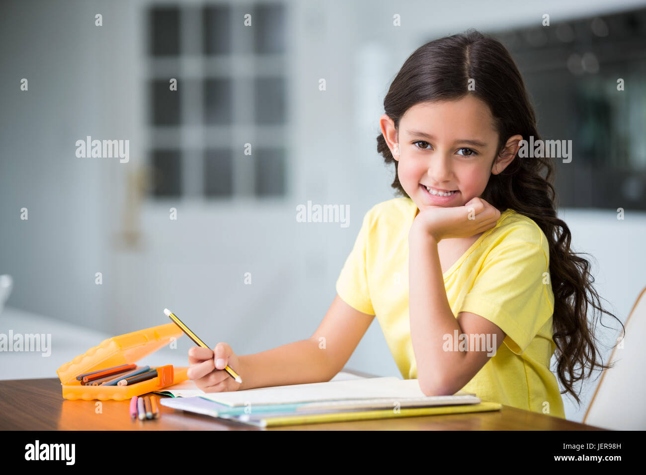 Girl desk homework chin hi-res stock photography and images - Alamy
