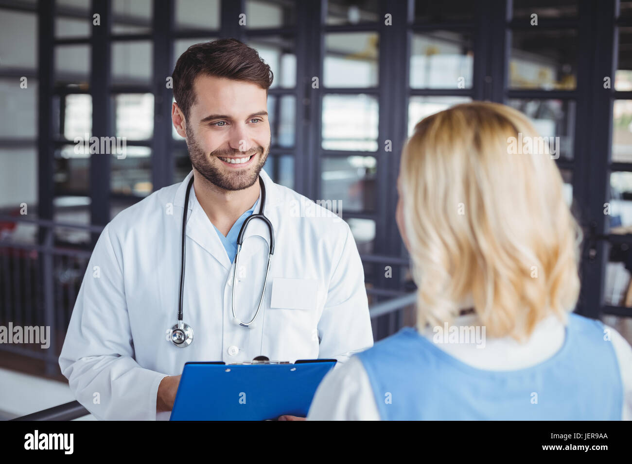 Smiling doctors discussing hi-res stock photography and images - Alamy
