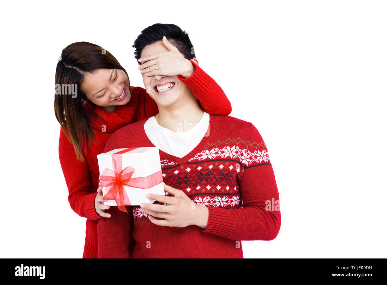 Woman giving a surprise gift to her man Stock Photo - Alamy