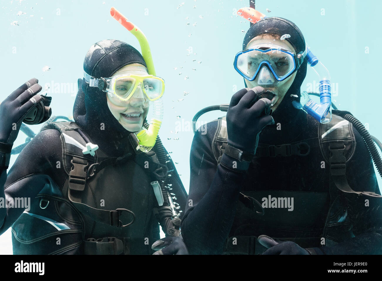 Couple practicing scuba diving together Stock Photo - Alamy