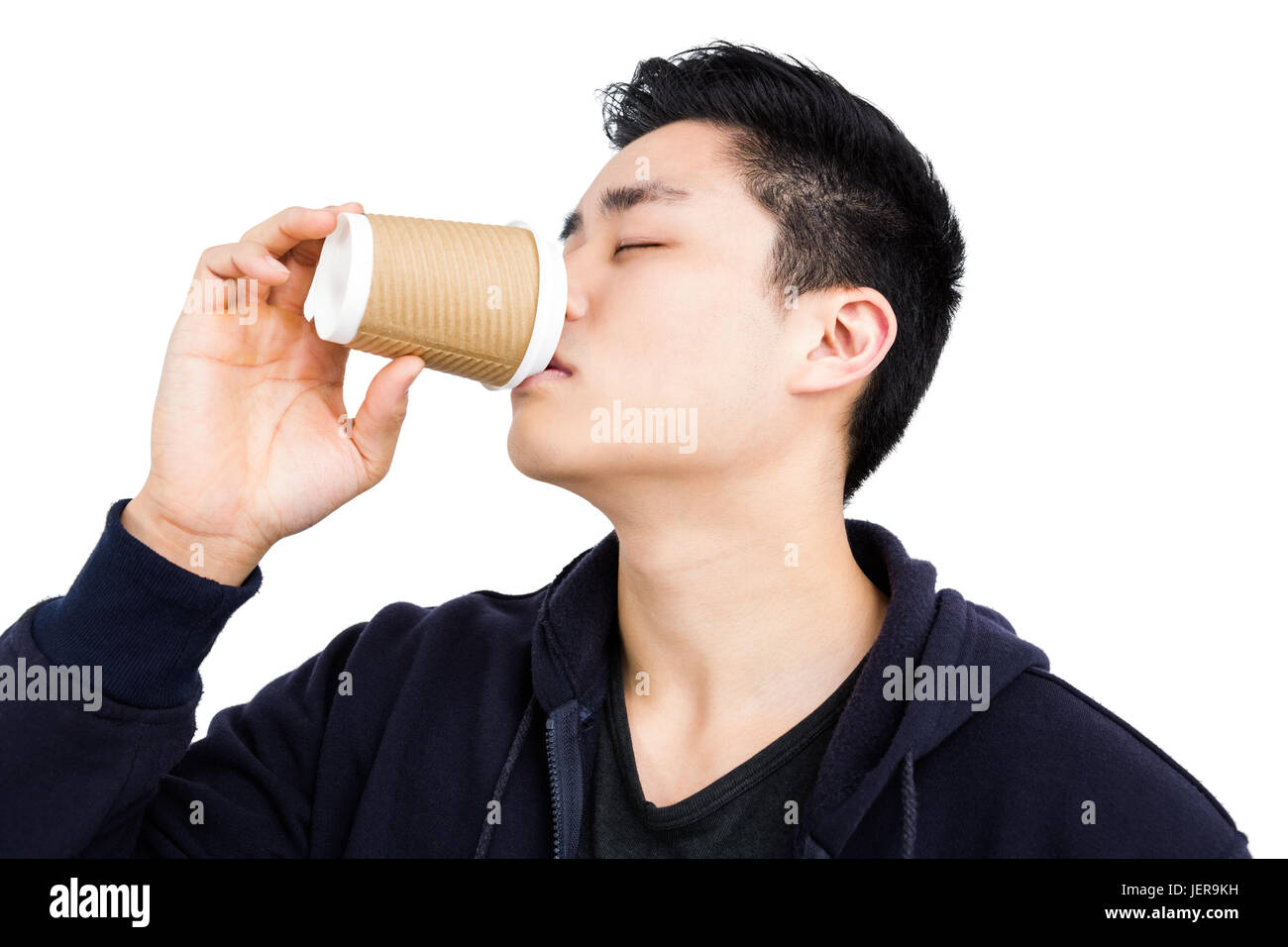 Young man having coffee Stock Photo - Alamy