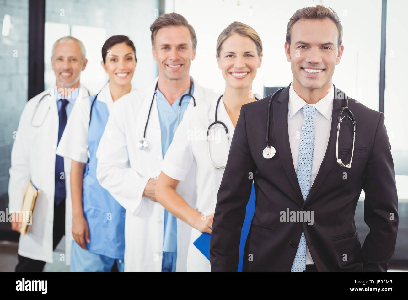 Medical team smiling in hospital Stock Photo - Alamy