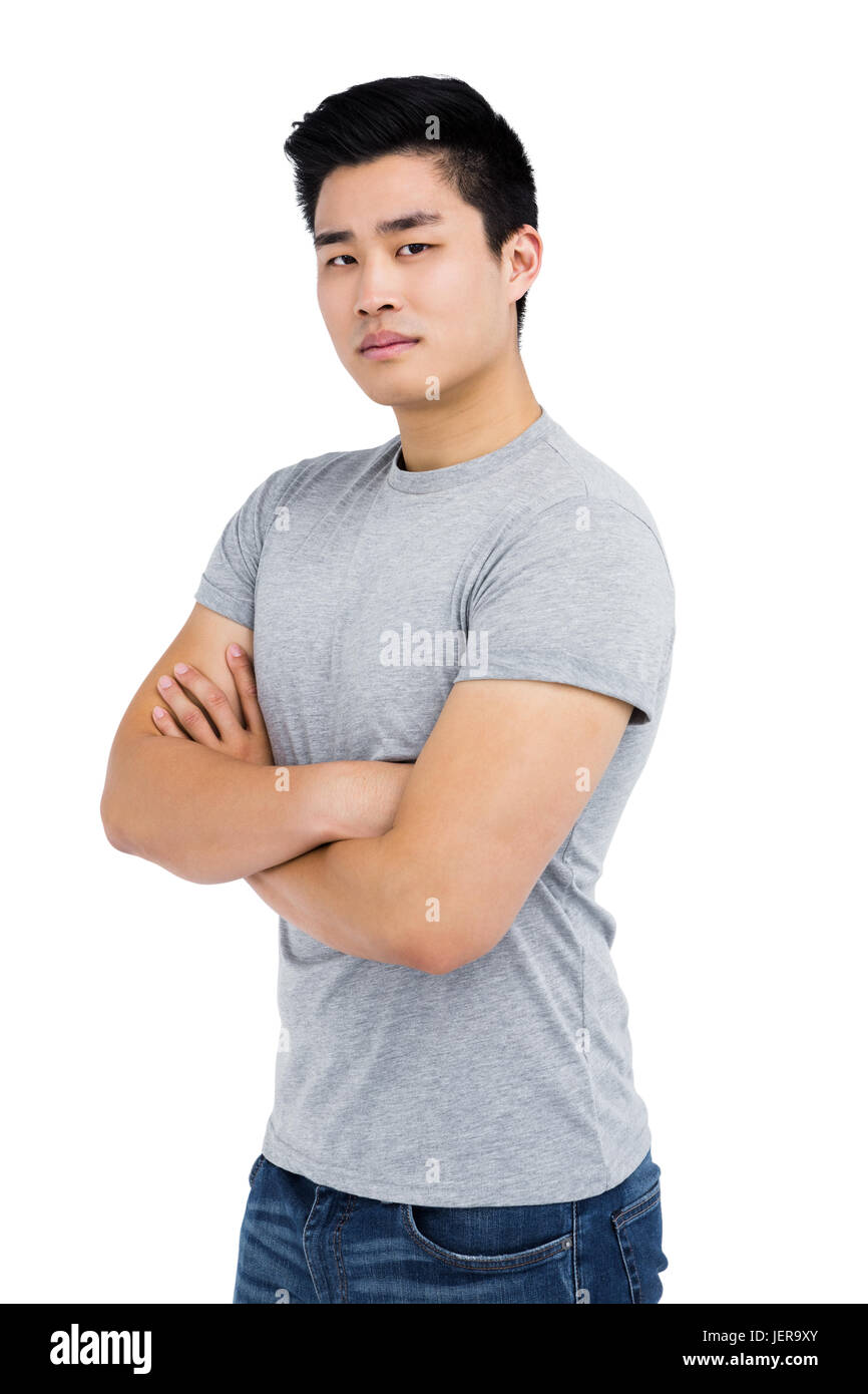 Man standing with arms crossed Stock Photo - Alamy