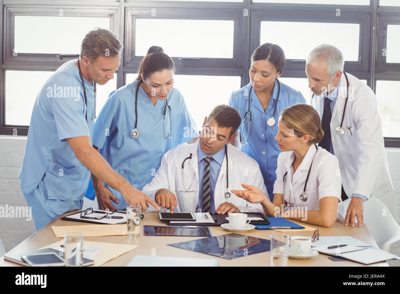 Medical team interacting in conference room Stock Photo - Alamy