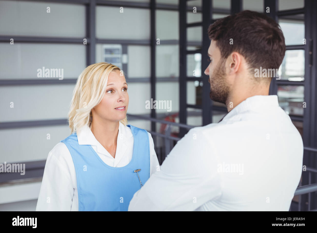 Doctors discussing while standing Stock Photo - Alamy