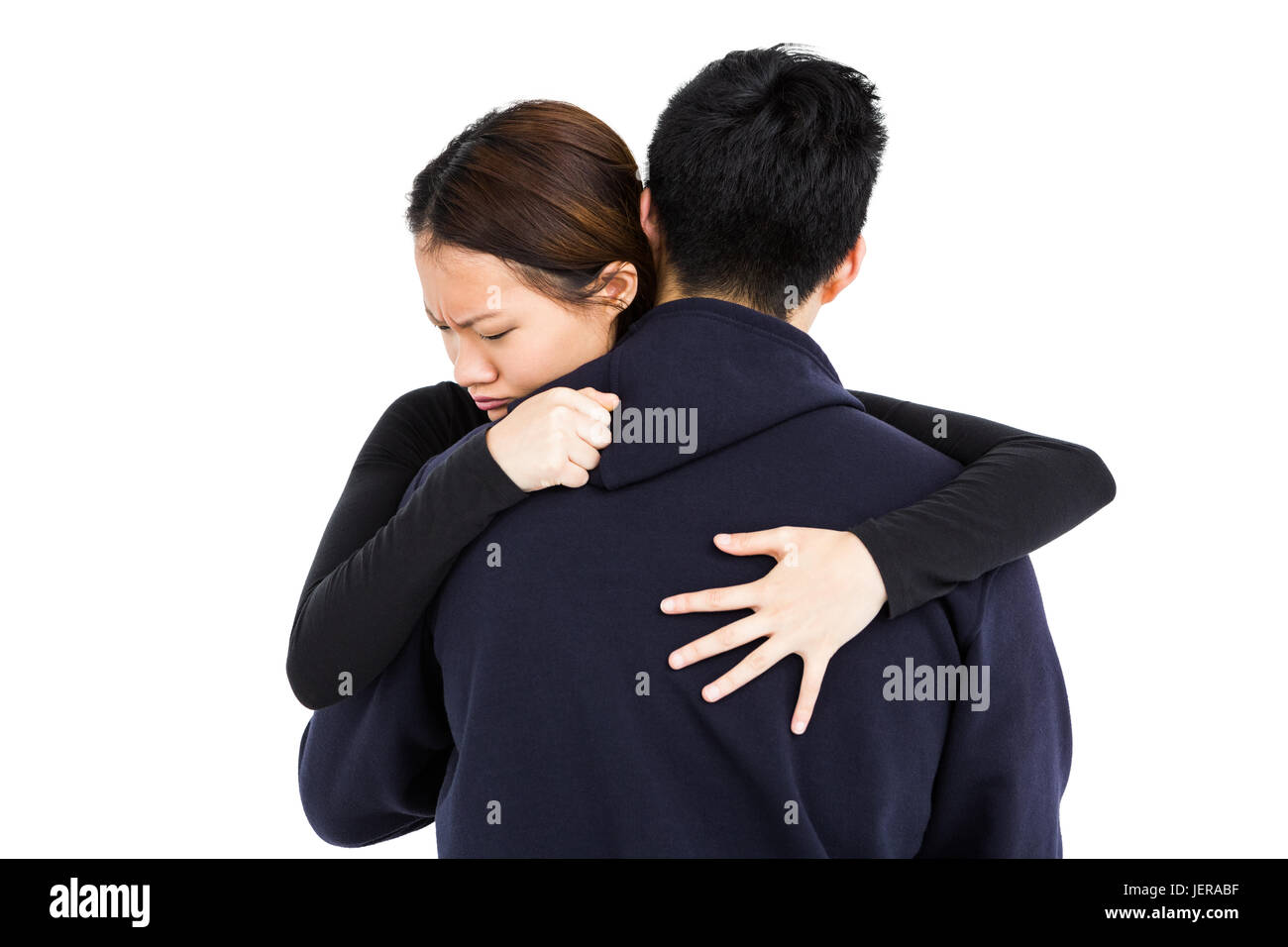 Young couple embracing Stock Photo - Alamy