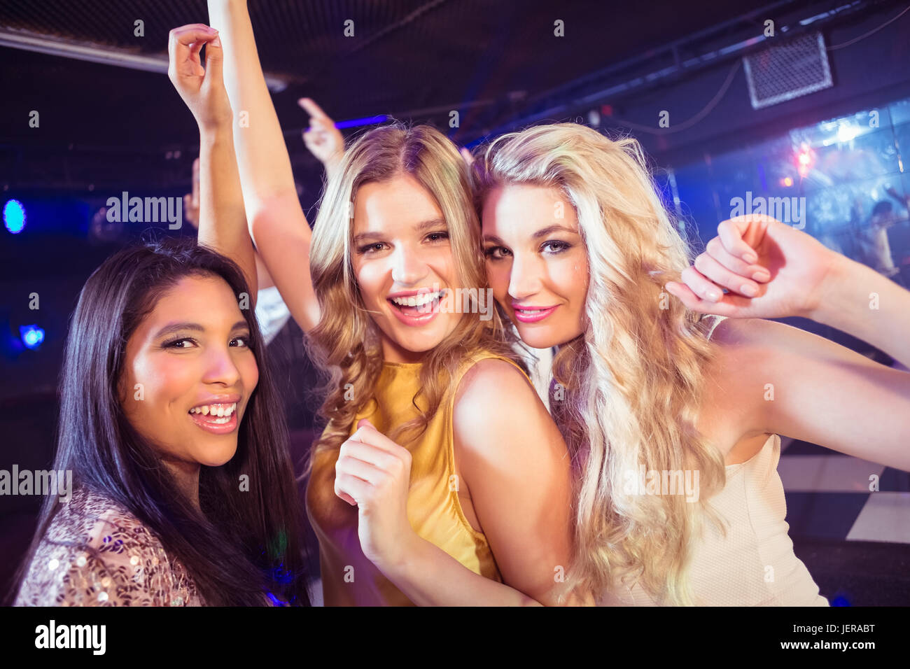 Happy friends dancing together Stock Photo - Alamy