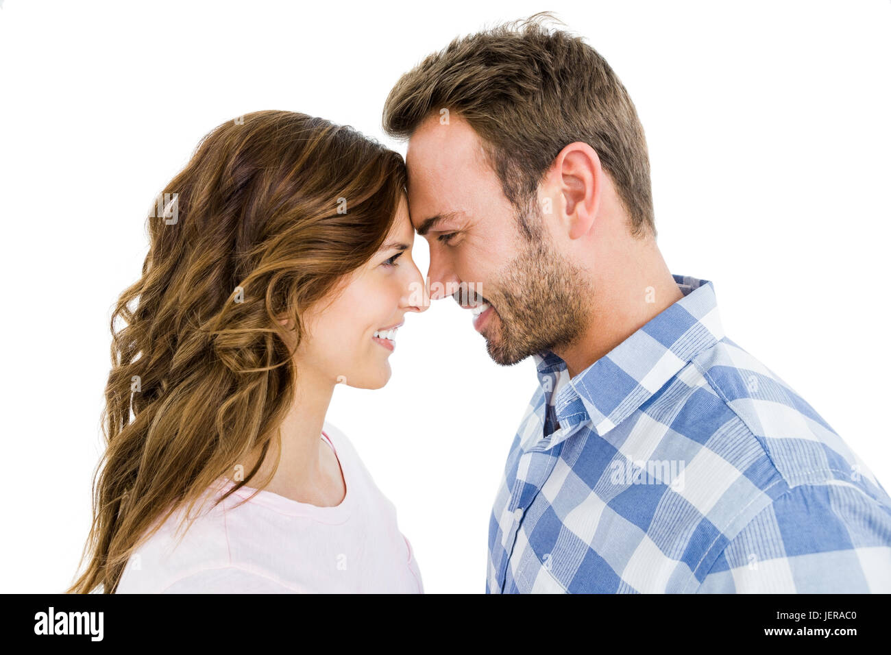 Happy young couple rubbing nose Stock Photo - Alamy