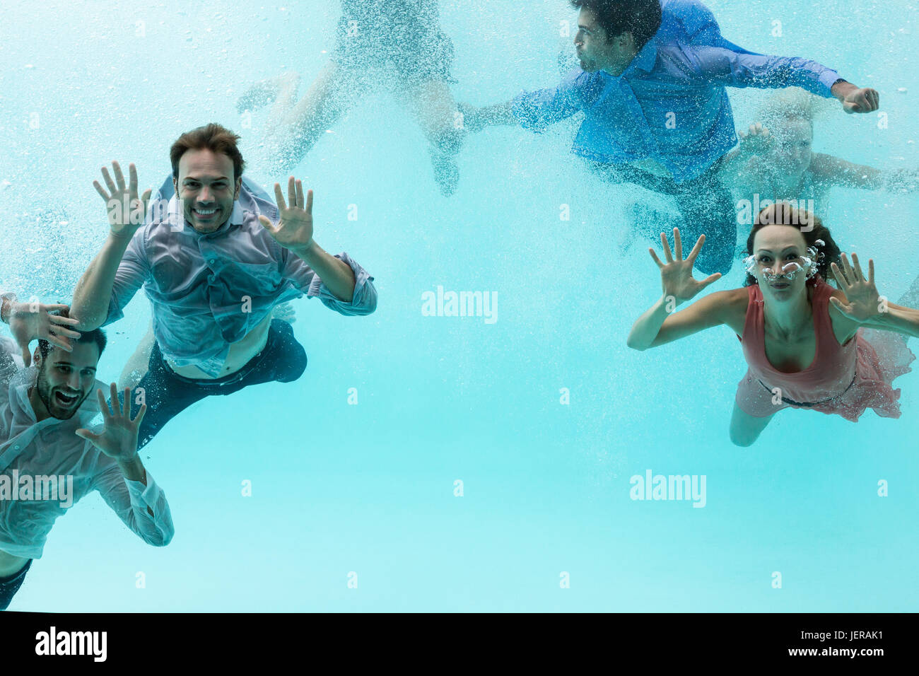 Friends swimming in pool Stock Photo - Alamy