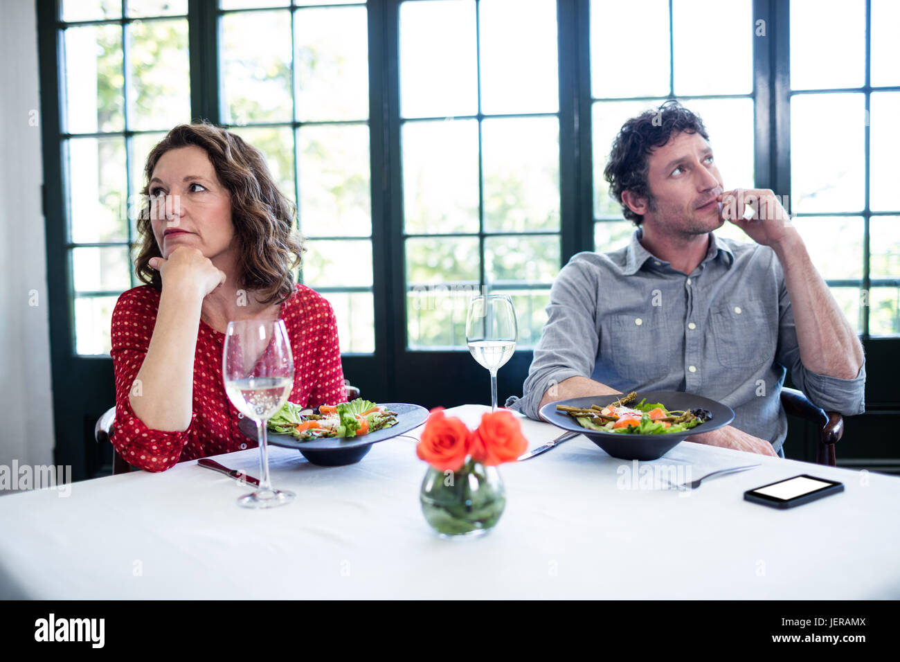 Woman feeling bored and ignoring each other Stock Photo - Alamy