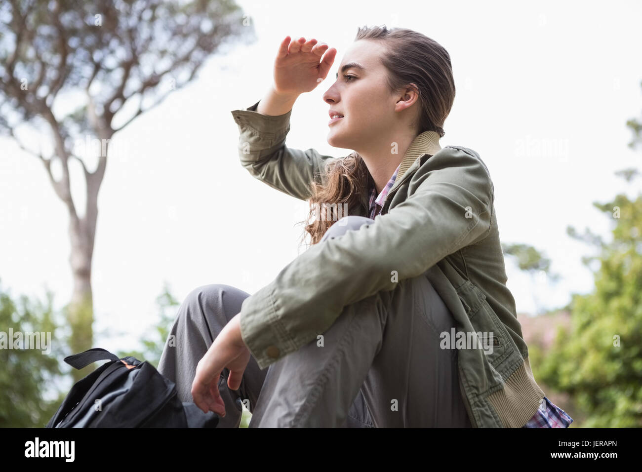 Woman observing something Stock Photo - Alamy
