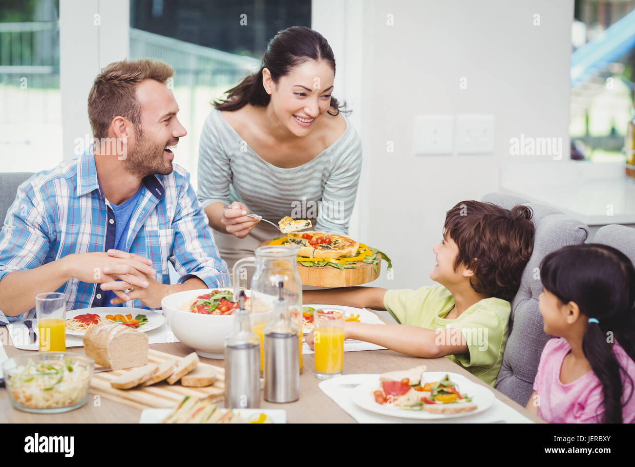 Mother serving food daughter hi-res stock photography and images - Alamy