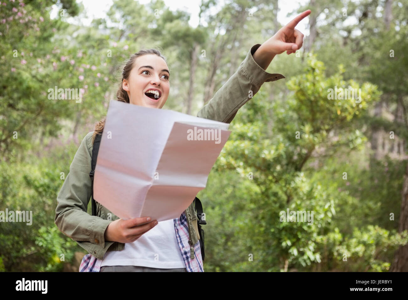 Woman checking the map Stock Photo - Alamy
