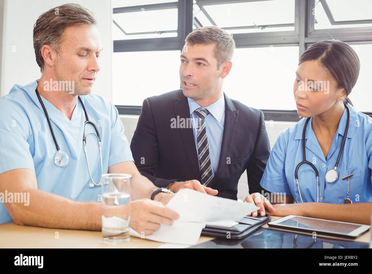 Medical team interacting in conference room Stock Photo - Alamy