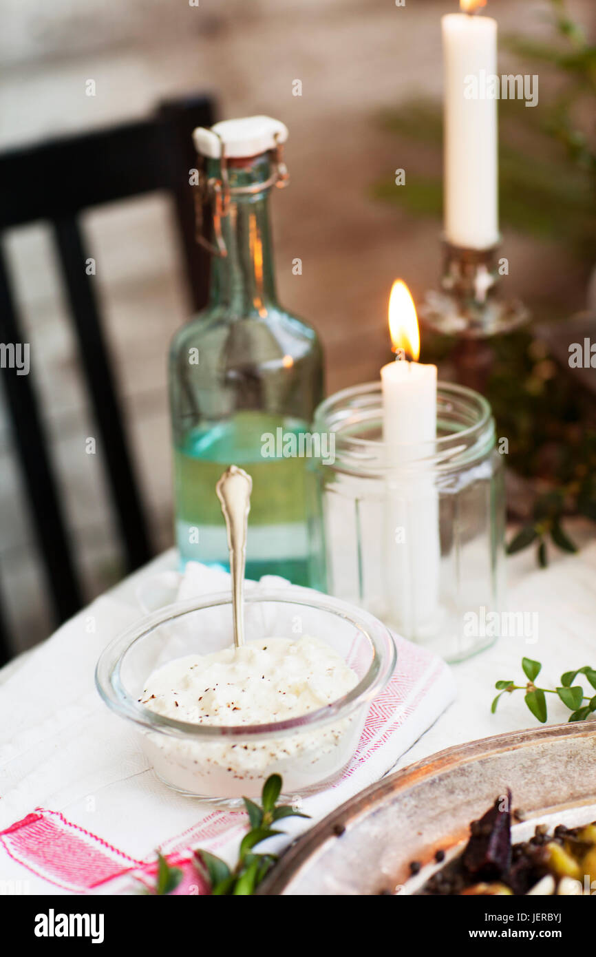 Candles and food on table Stock Photo - Alamy