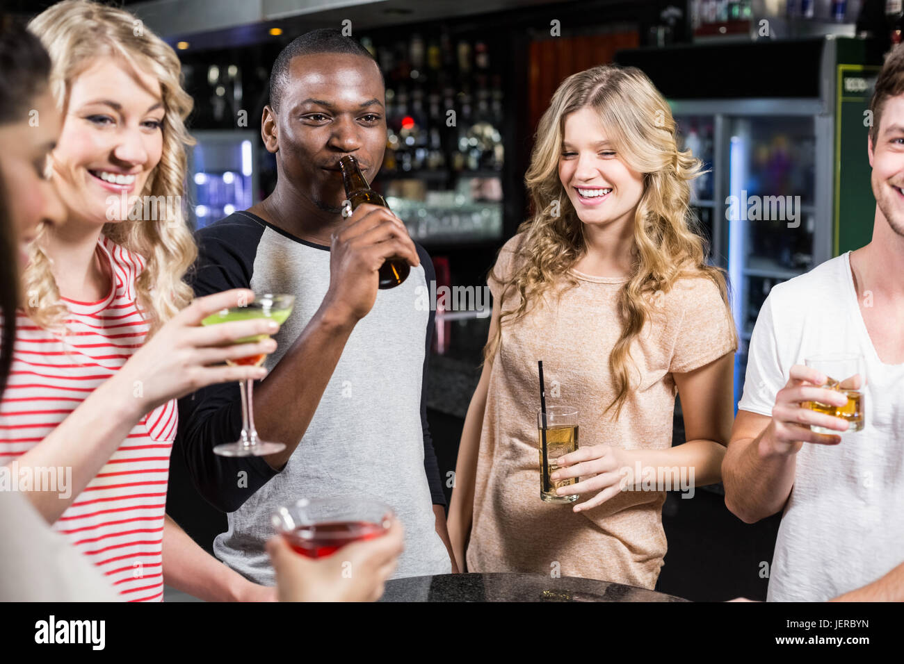 Group of friends having a drink Stock Photo - Alamy