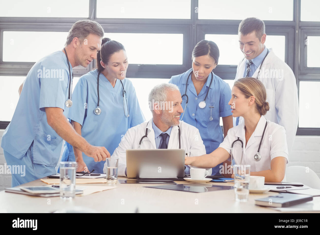 Medical team interacting in conference room Stock Photo - Alamy