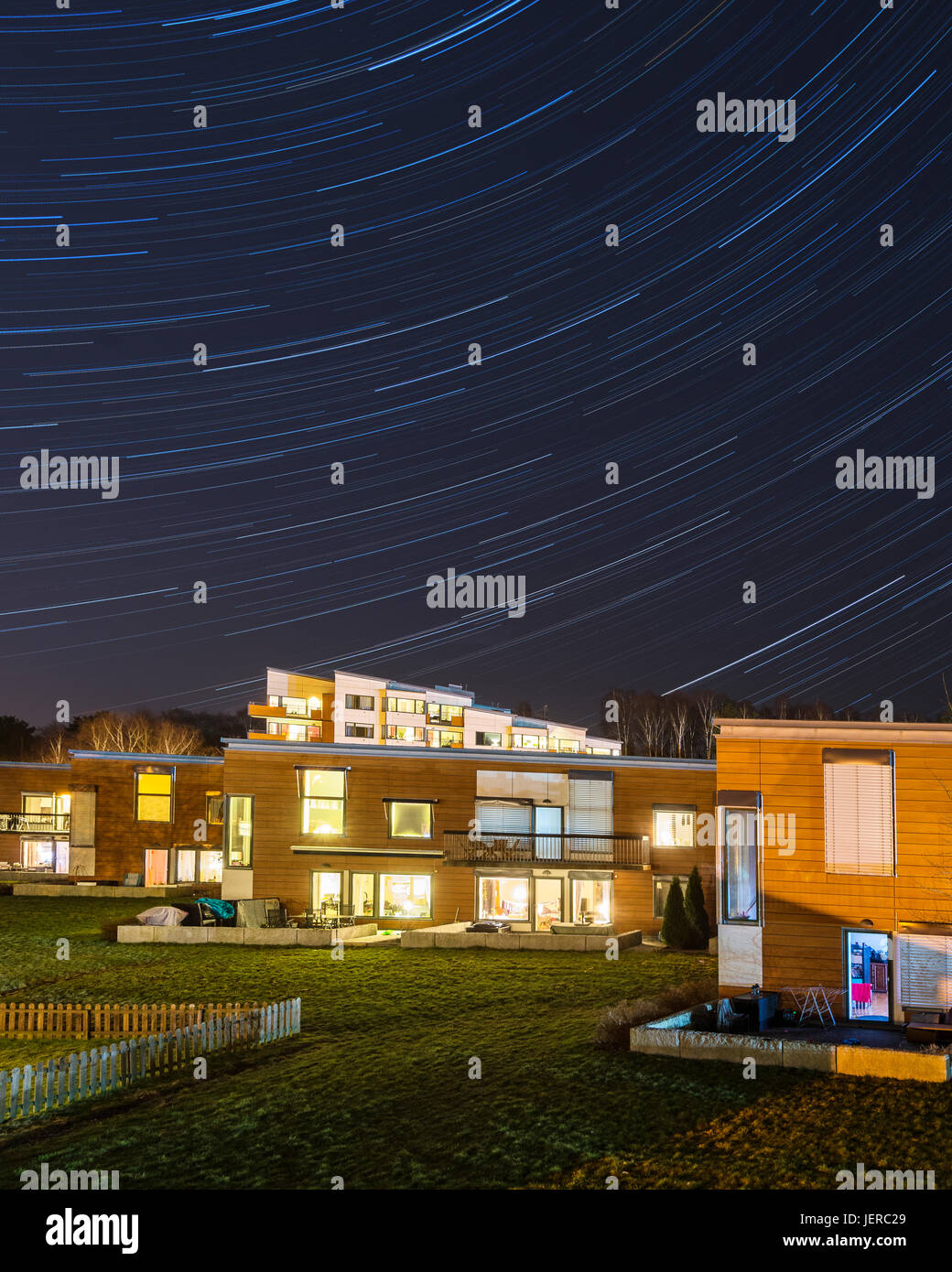 Illuminated buildings with star trails Stock Photo - Alamy