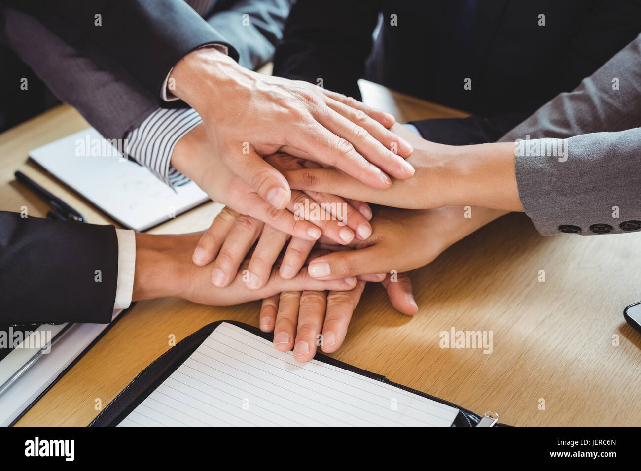 Businesspeople stacking hands hi-res stock photography and images - Alamy
