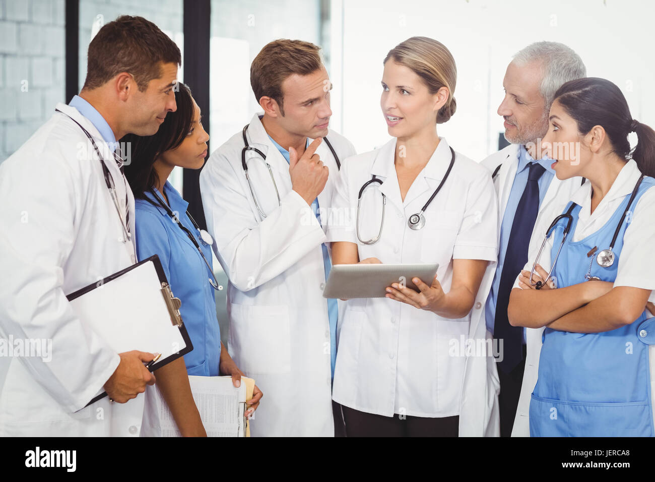 Medical team interacting with each other Stock Photo - Alamy