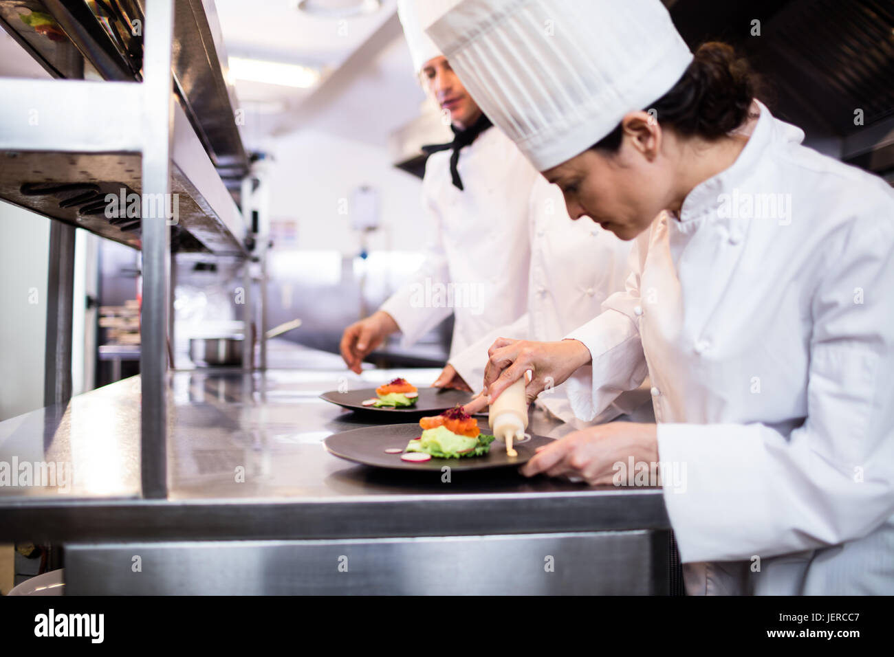 Chef decorating a food plate Stock Photo - Alamy