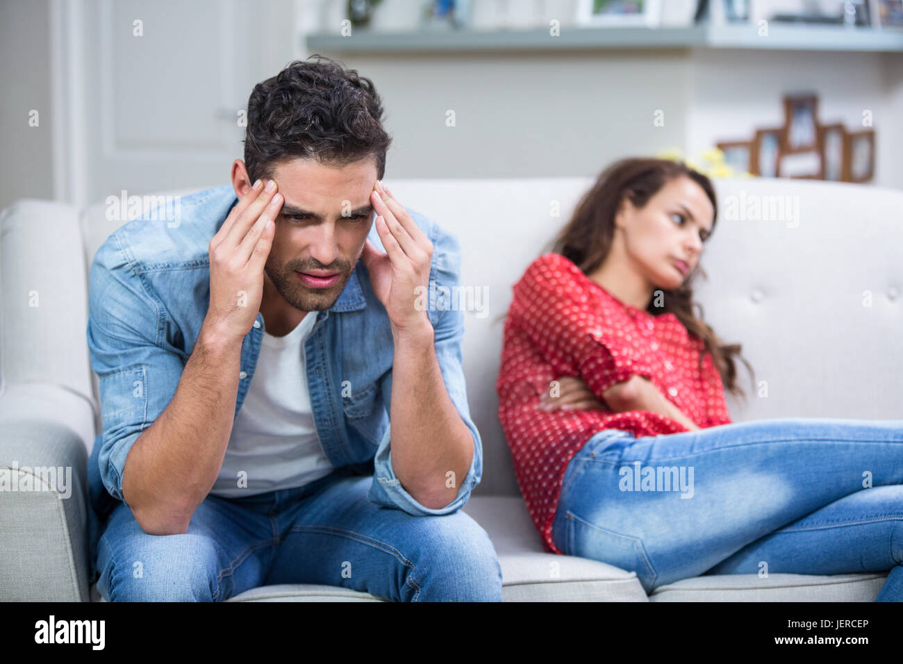 Tensed man after argument with woman Stock Photo - Alamy