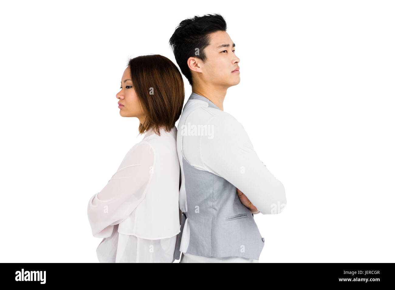 Depressed couple standing back to back Stock Photo - Alamy