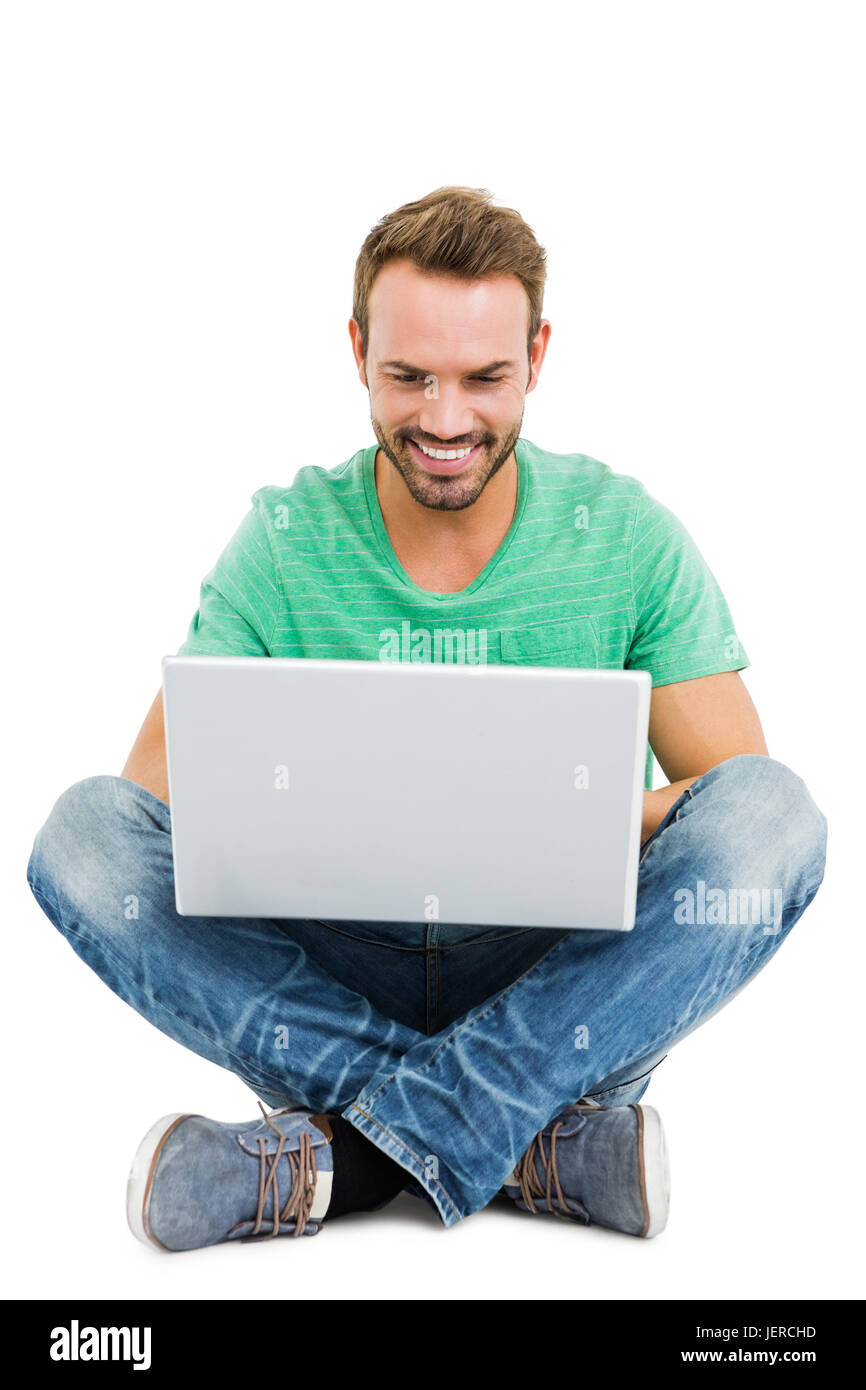 Young man using laptop Stock Photo - Alamy