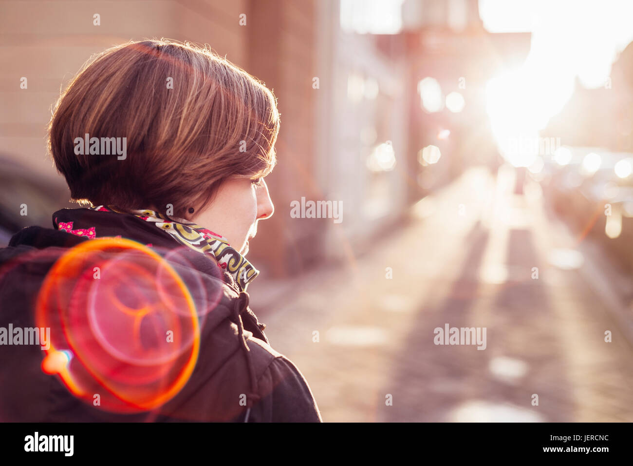 Young woman looking away Stock Photo - Alamy