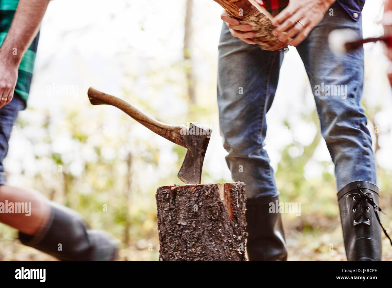 Men chopping wood Stock Photo - Alamy