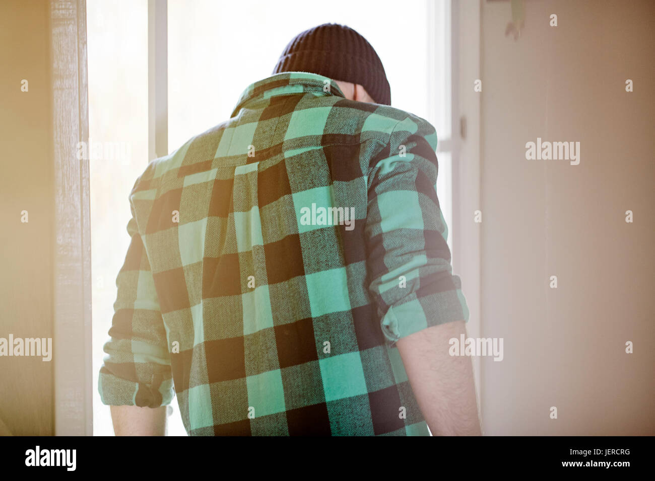 Men near window Stock Photo - Alamy