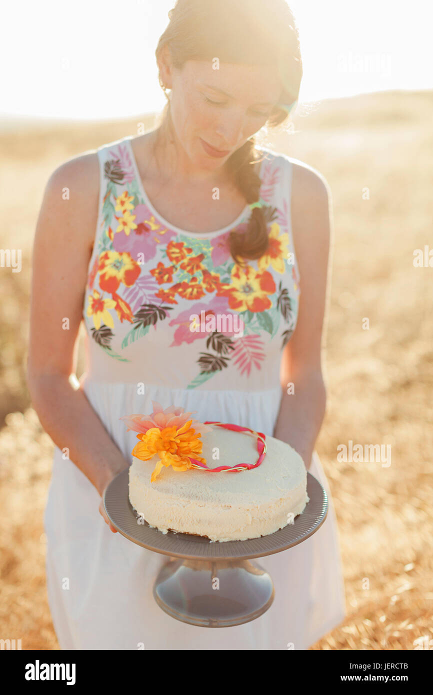 Woman holding cake Stock Photo - Alamy