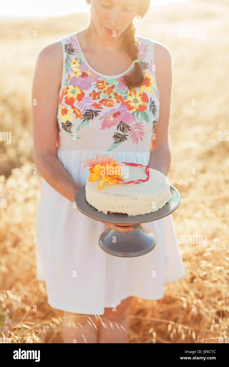 Woman holding cake Stock Photo - Alamy