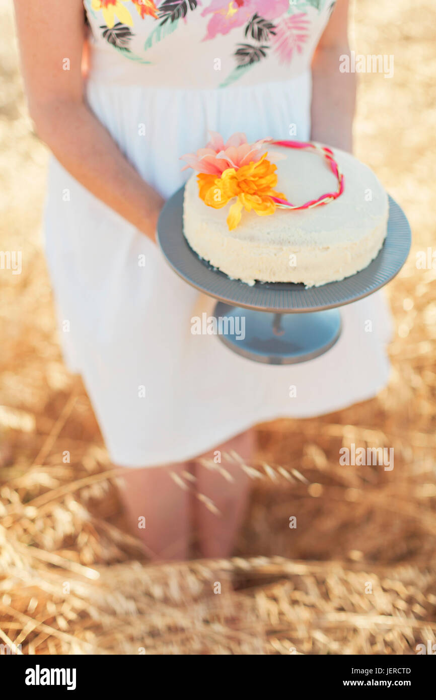 Woman holding cake Stock Photo - Alamy