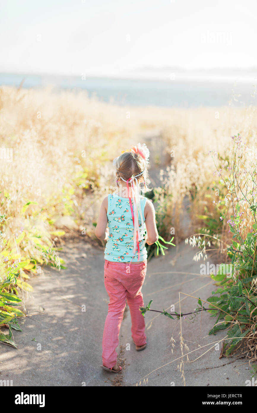 Girl walking, rear view Stock Photo - Alamy