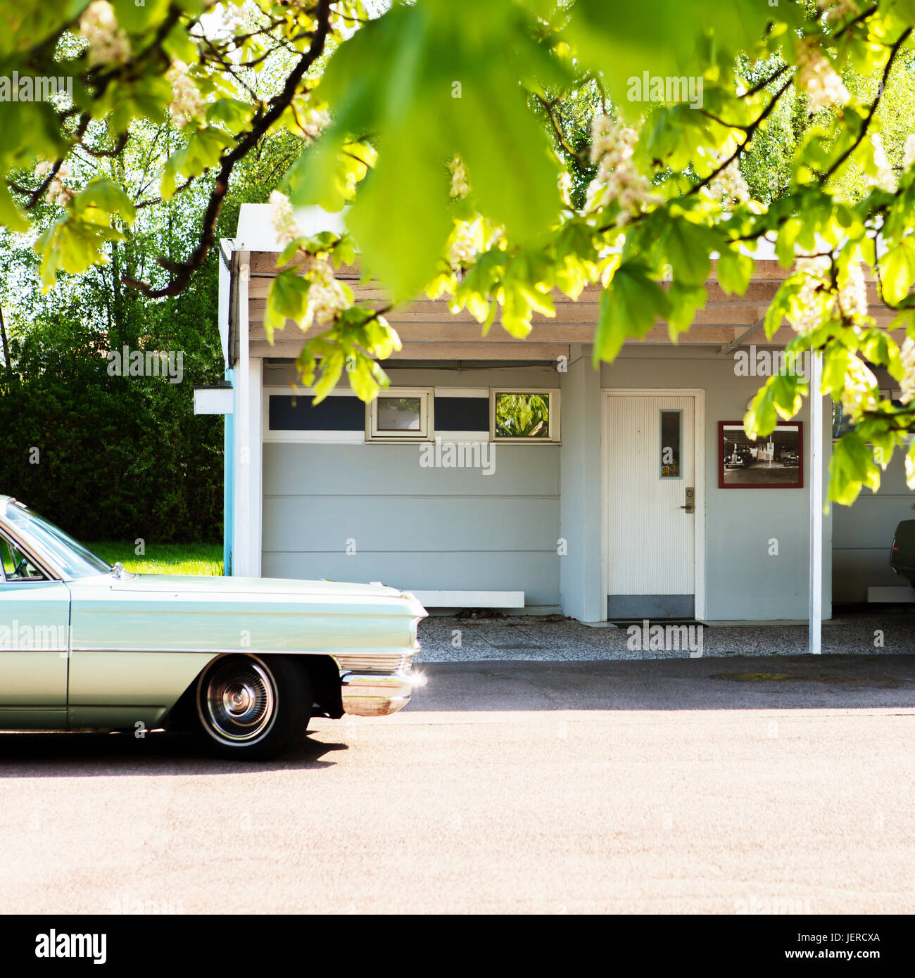 Vintage car in front of house Stock Photo - Alamy