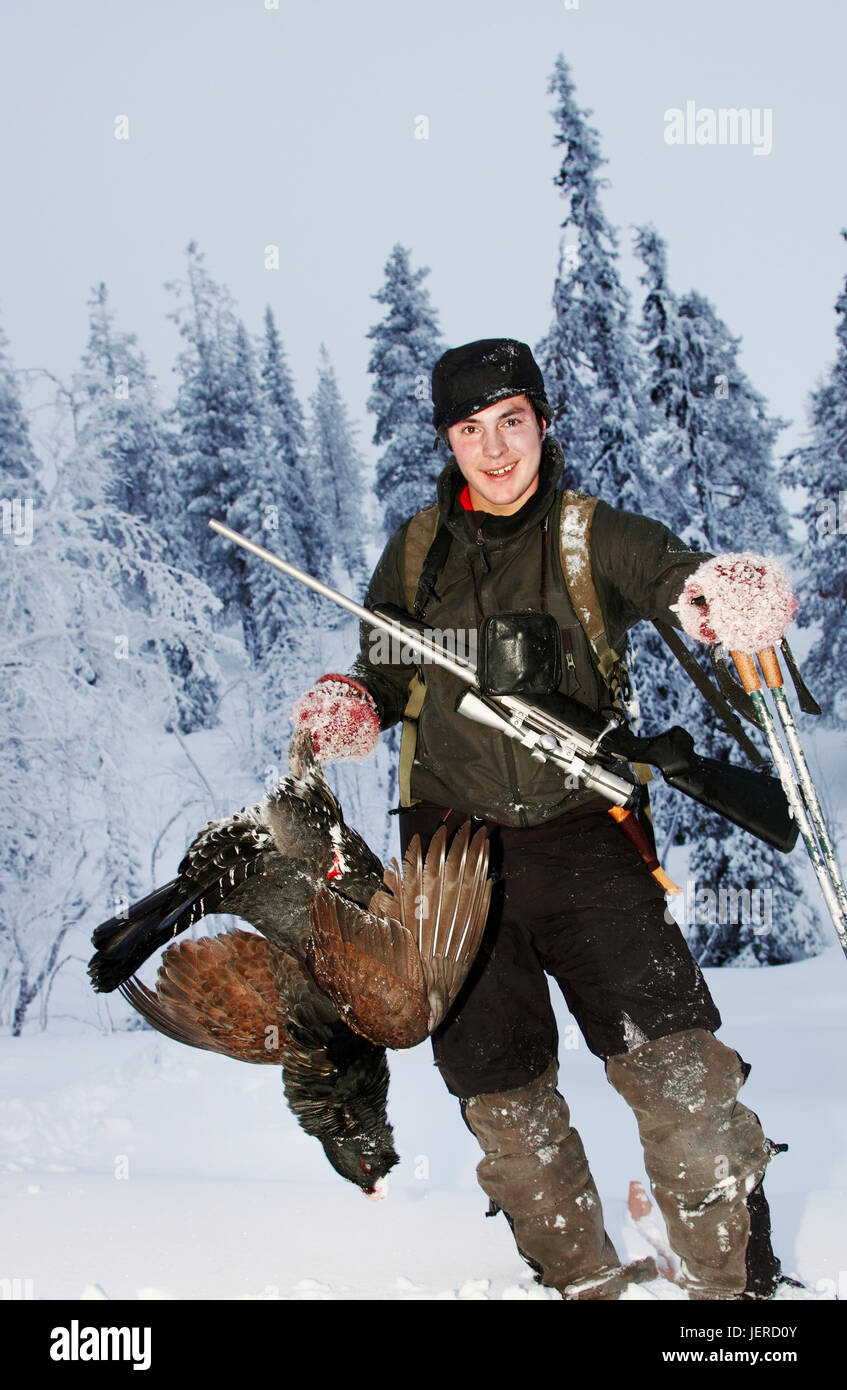 Hunter holding dead bird Stock Photo - Alamy