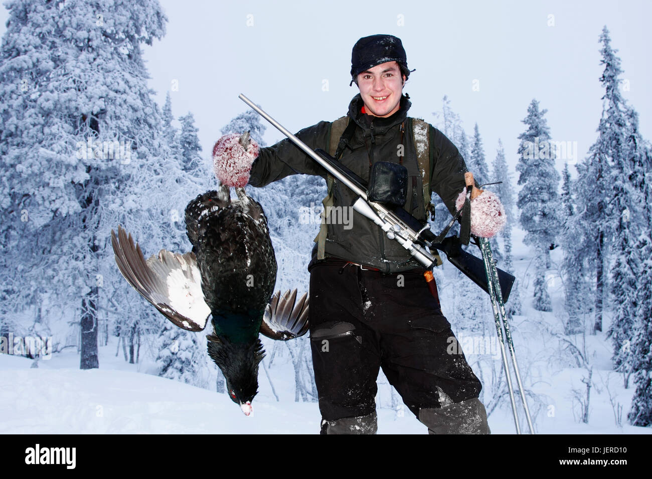 Hunter holding dead bird Stock Photo - Alamy