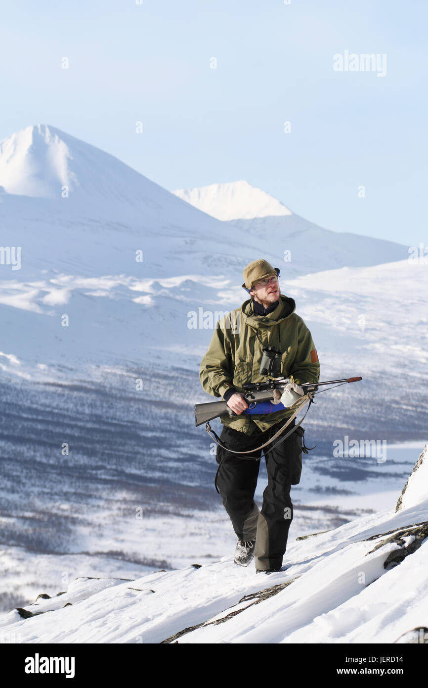 Hunter in mountains Stock Photo - Alamy