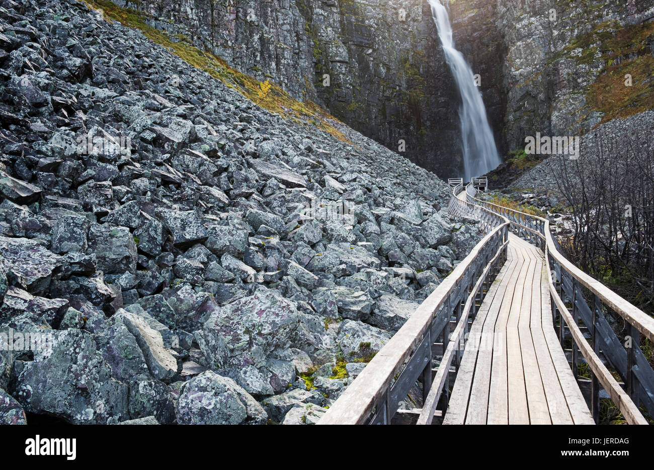 Wooden path leading to waterfall Stock Photo - Alamy