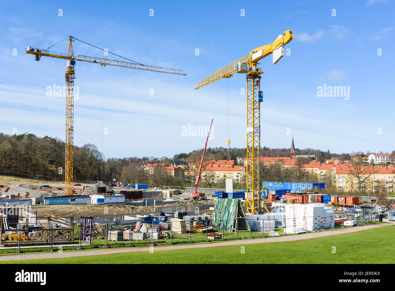 Building cranes on construction site Stock Photo - Alamy