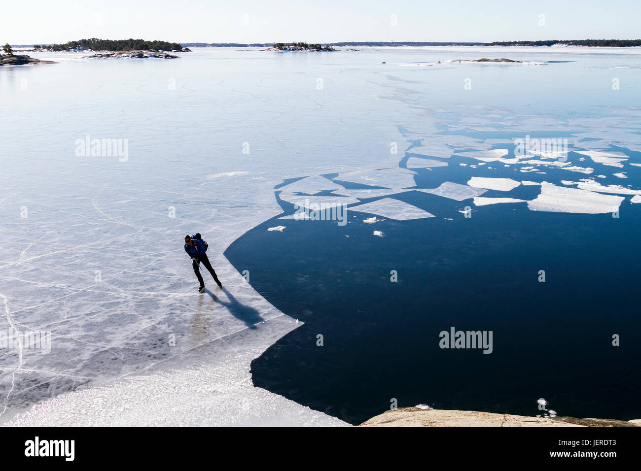 Person ice-skating on frozen water Stock Photo - Alamy
