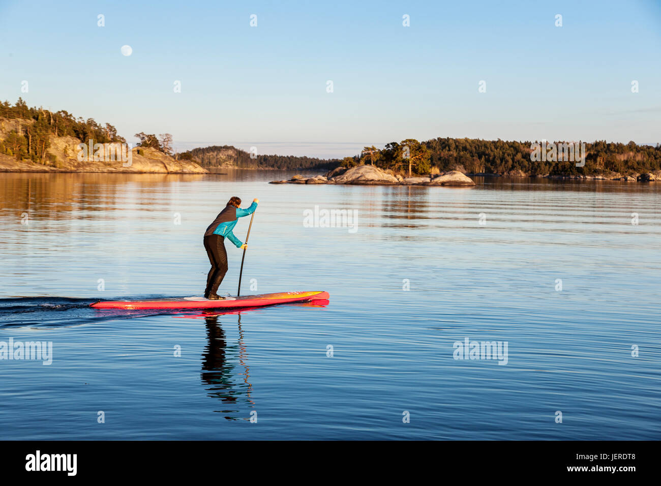 Person on paddleboard Stock Photo - Alamy