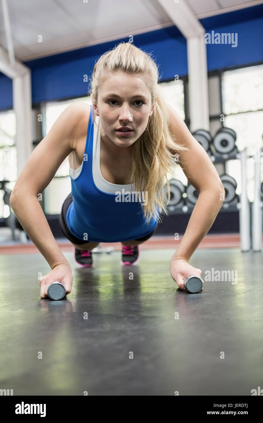Determined woman doing push ups Stock Photo - Alamy